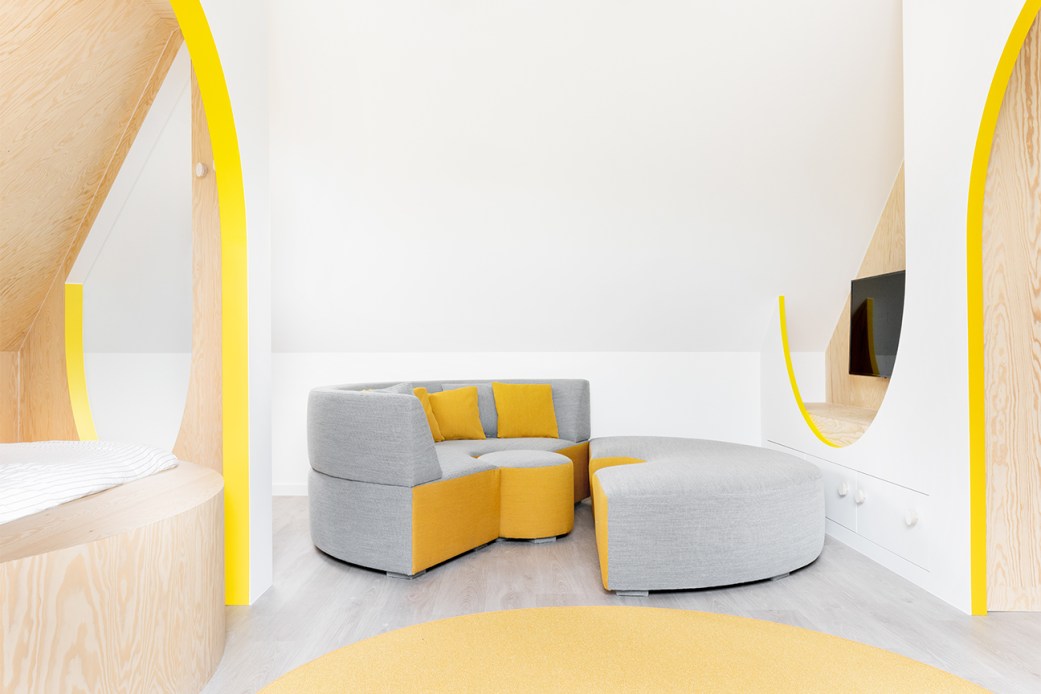 Bright Yellow Arches Lead the Way in This Attic-Turned-Playroom in Belgium