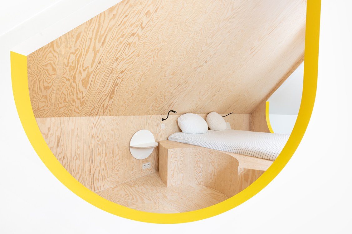 Bright Yellow Arches Lead the Way in This Attic-Turned-Playroom in Belgium