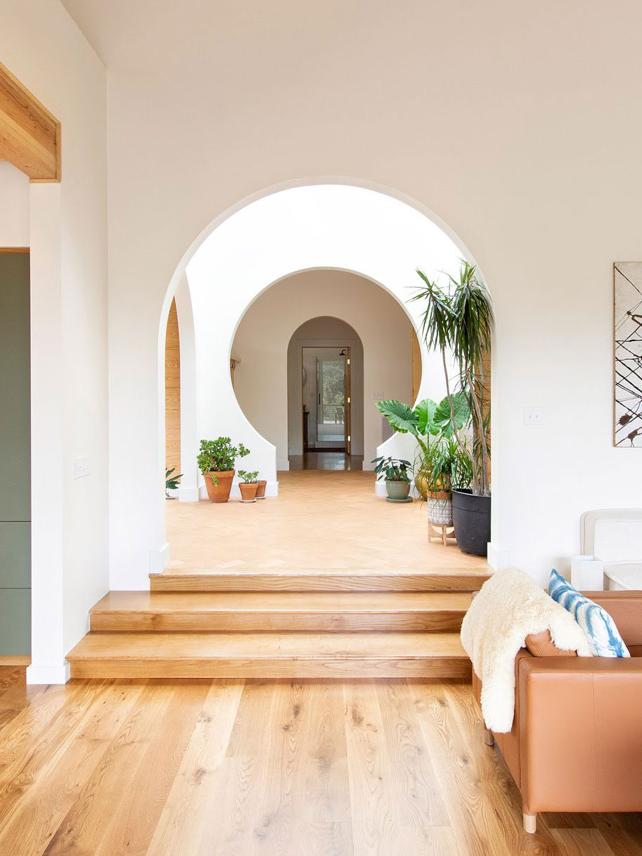 A Keyhole Archway Hides Shoe Cubbies in This Asheville Home's Front Hallway