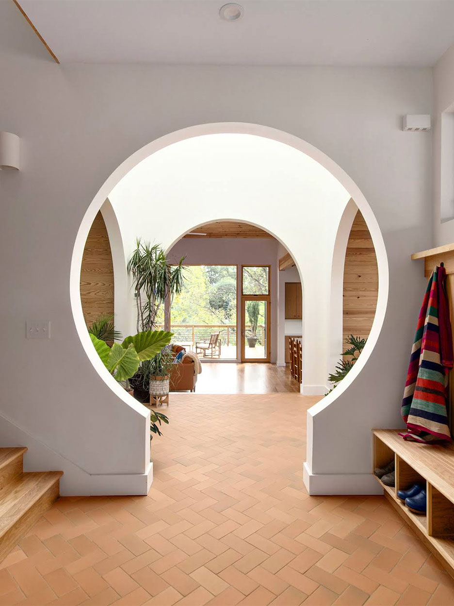 A Keyhole Archway Hides Shoe Cubbies in This Asheville Home's Front Hallway