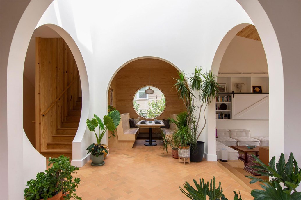 A Keyhole Archway Hides Shoe Cubbies in This Asheville Home's Front Hallway