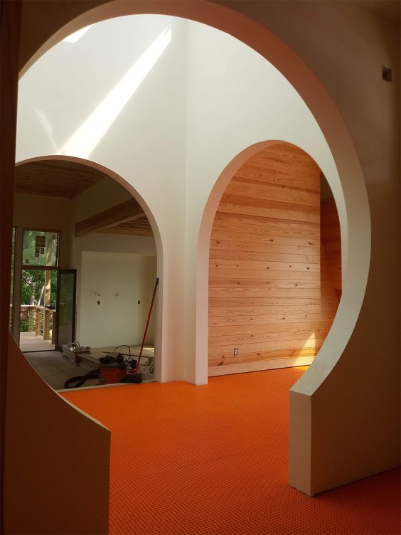 A Keyhole Archway Hides Shoe Cubbies in This Asheville Home's Front Hallway