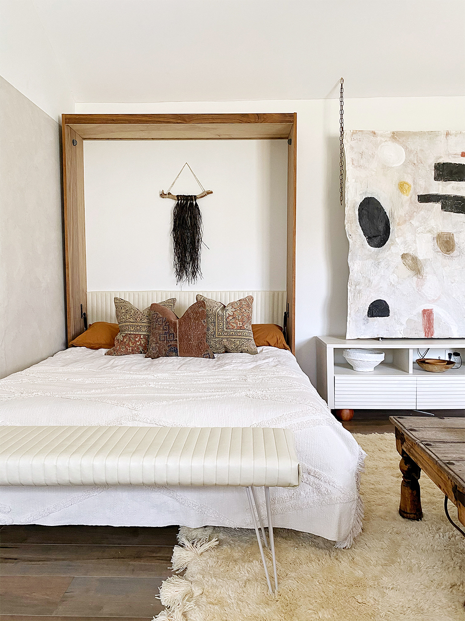 A DIY Den Renovation Where an Abstract Tapestry Now Hides the TV