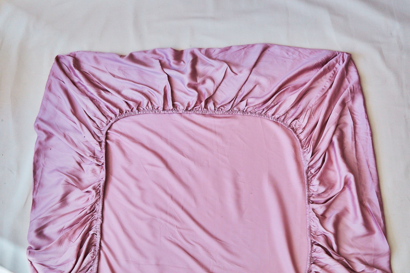 How to Fold a Fitted Sheet So It Actually Stacks Neatly