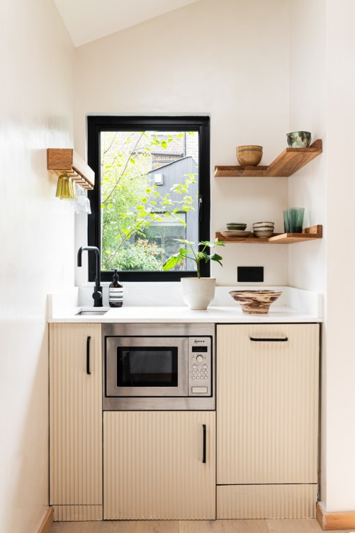 A Tiny Guest House with “The World’s Smallest Sink” and Fluted Cabinets