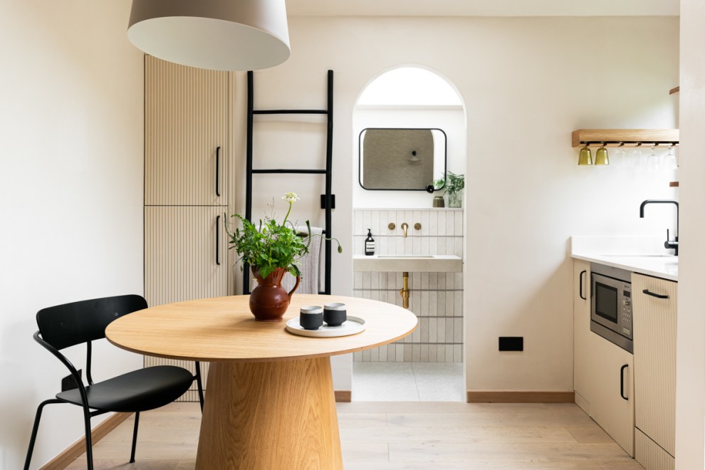 A Tiny Guest House with “The World’s Smallest Sink” and Fluted Cabinets