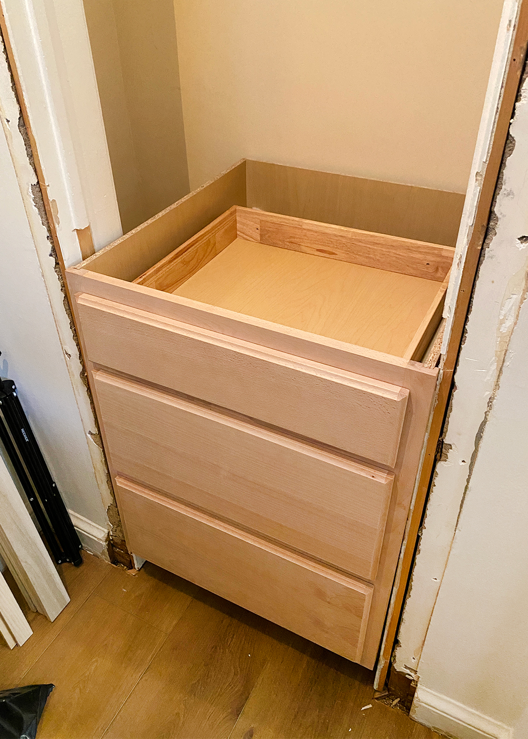 A Lower Kitchen Cabinet Maximized This Entryway Closet’s Wasted Space