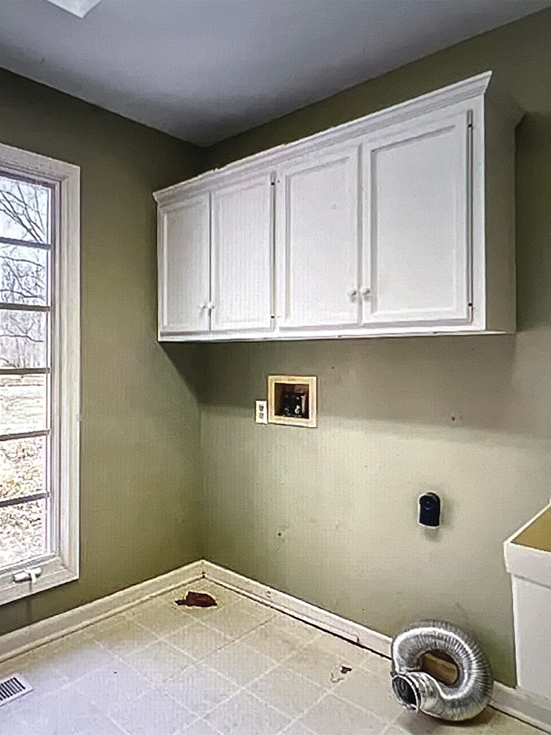 An Old English-Inspired Laundry Room Reno That’s Still Extremely Practical