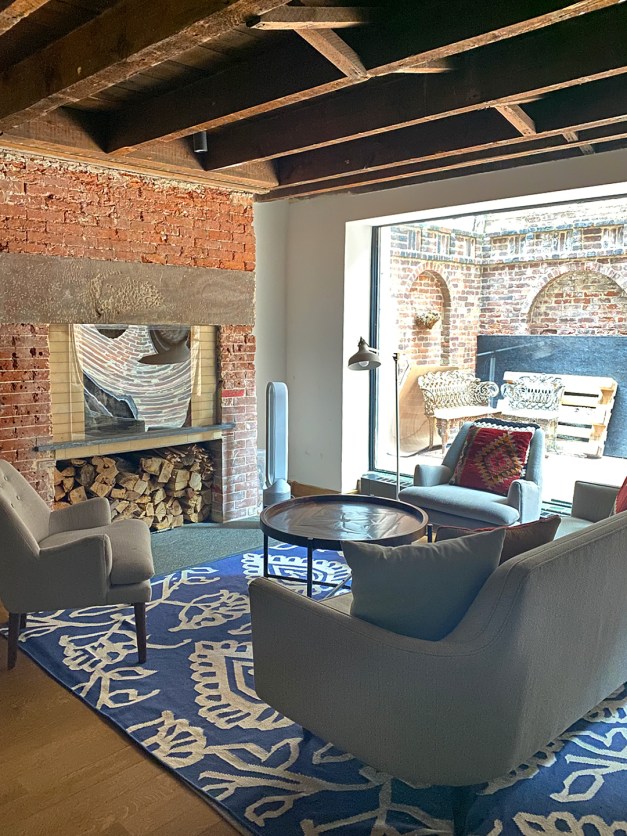 A Designer’s Tips for Decorating Around a Room with Exposed Brick