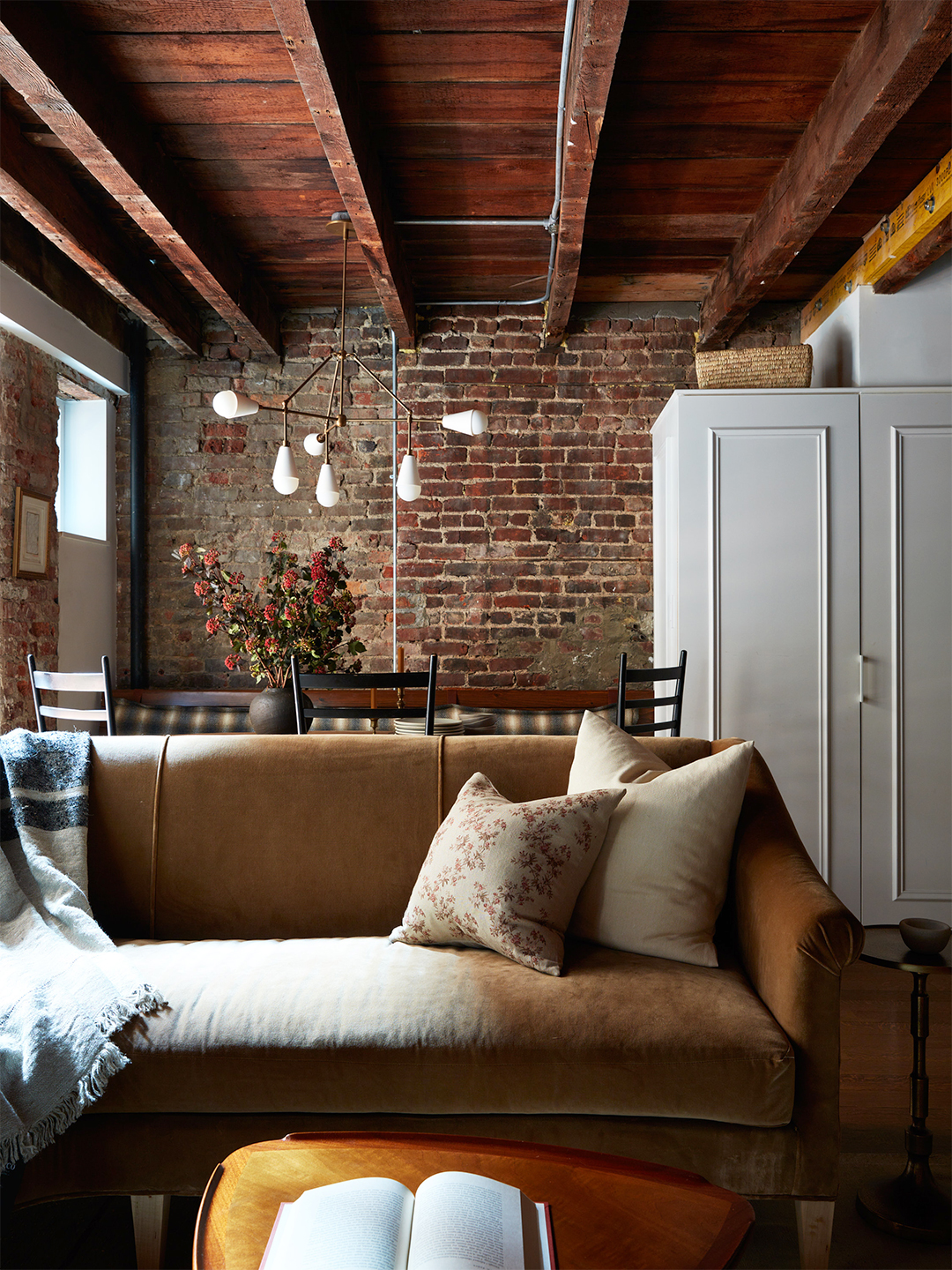 A Designer’s Tips for Decorating Around a Room with Exposed Brick
