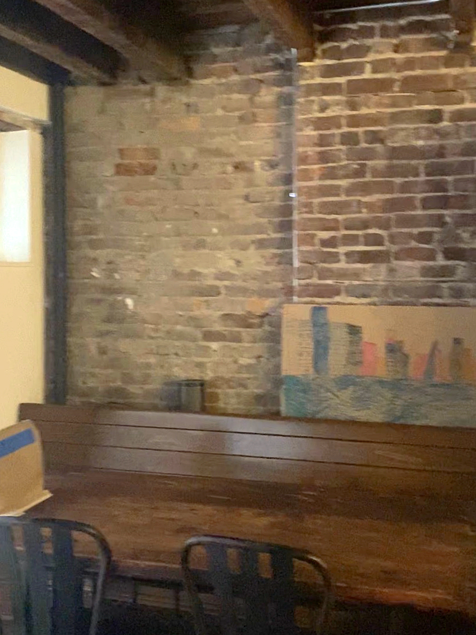 A Designer’s Tips for Decorating Around a Room with Exposed Brick