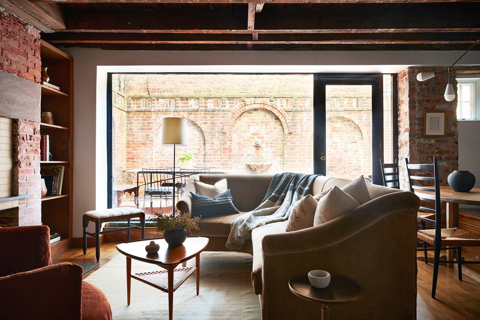 A Designer’s Tips for Decorating Around a Room with Exposed Brick