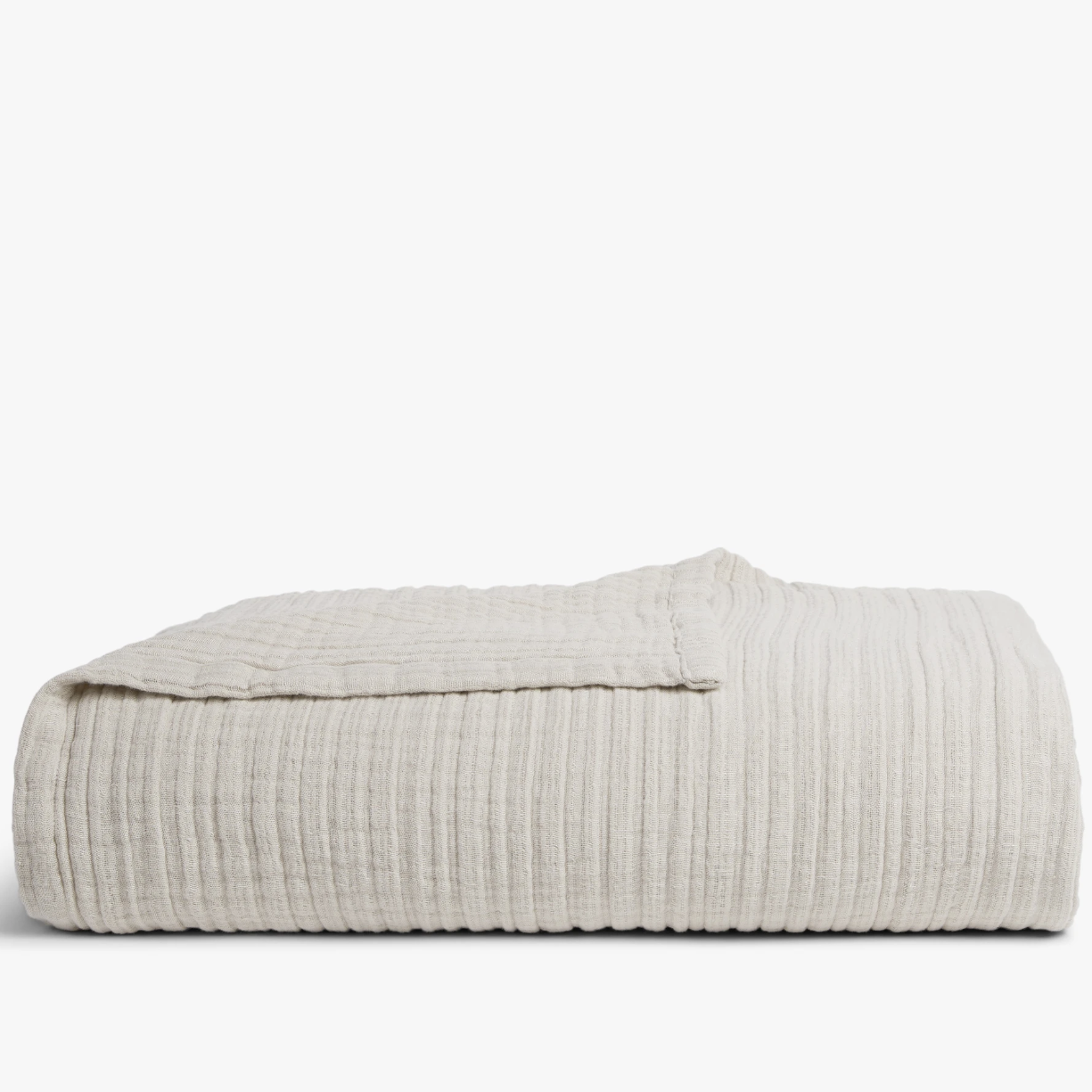 10 Lightweight Throw Blankets To Layer On Your Bed This Summer | domino