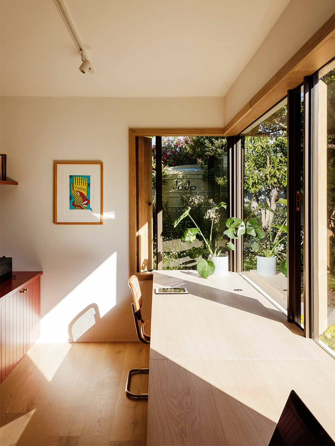 This Home's Unique Shutters Made Way for Big Picture Windows