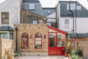 This Architect's Bright Red Kitchen Windows and Beams Can’t Go Unnoticed