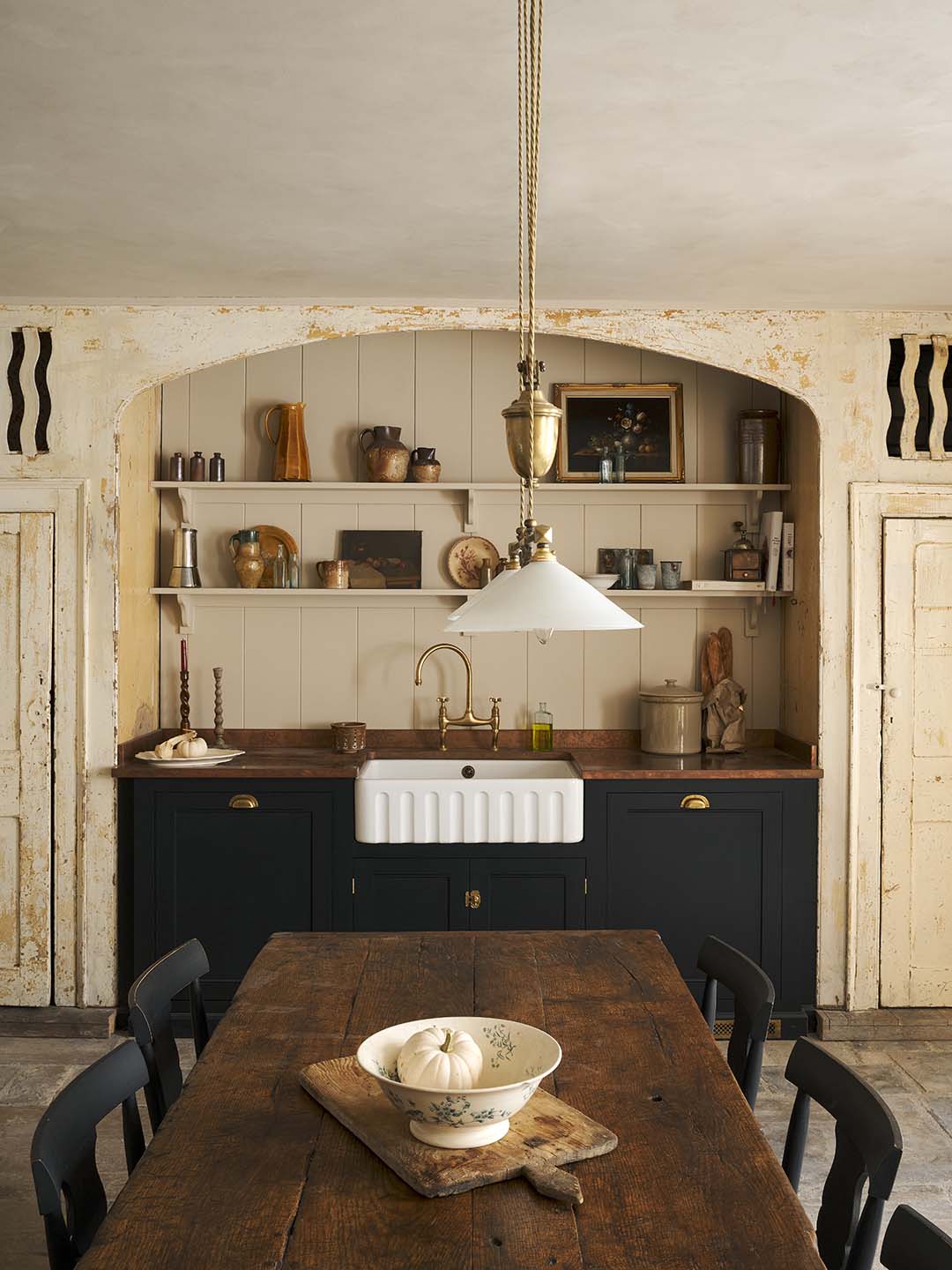 See How Limewash and a Little Black Magic Bring This Basement Kitchen ...