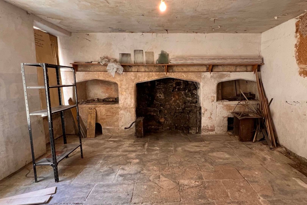 See How Limewash and a Little Black Magic Bring This Basement Kitchen ...