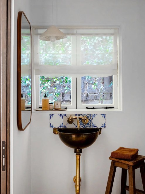 8 Bathroom Mirror Ideas for When There’s a Window in Your Way